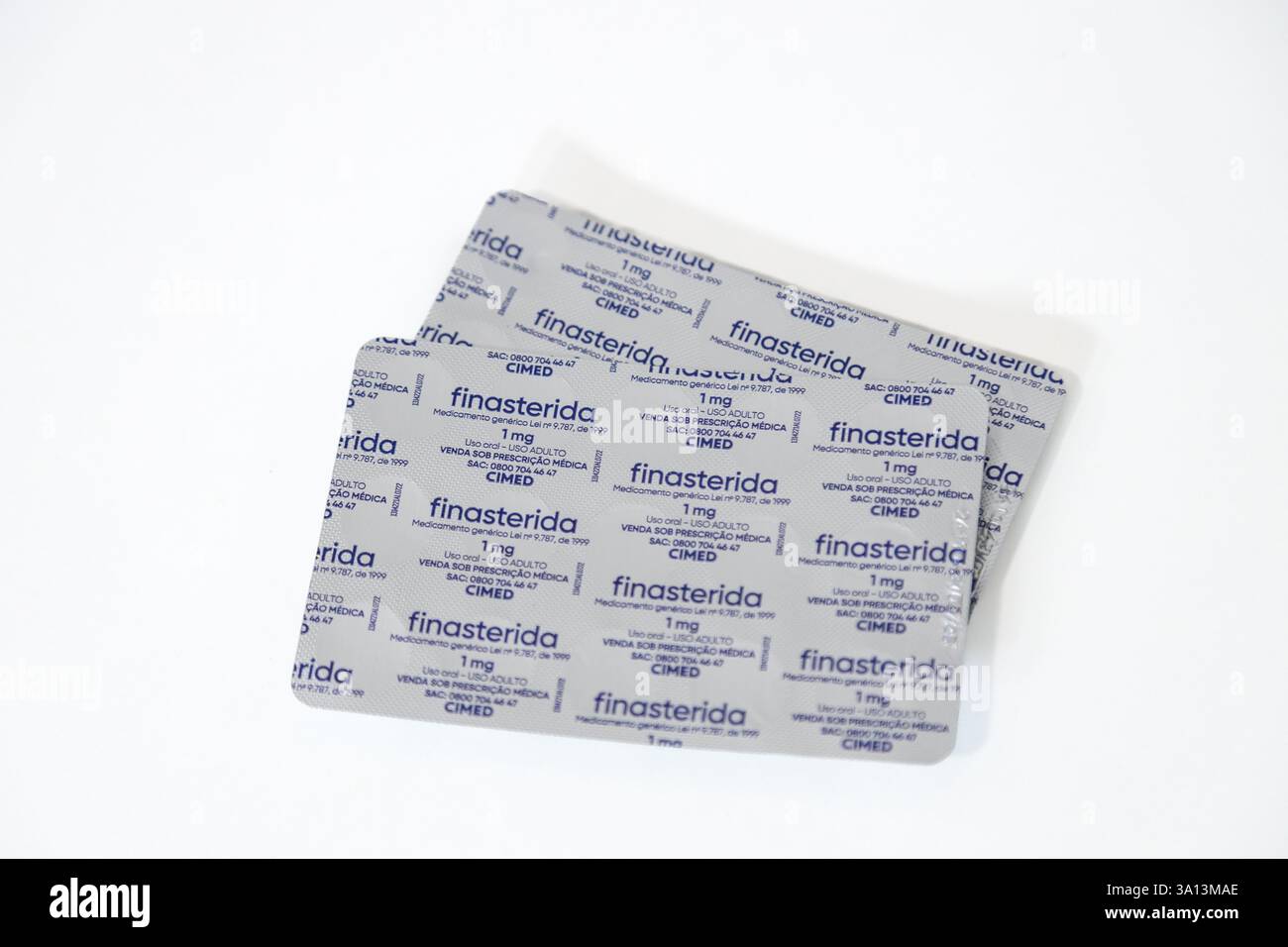 A blister pack containing Finasteride 1mg, a generic medication ...