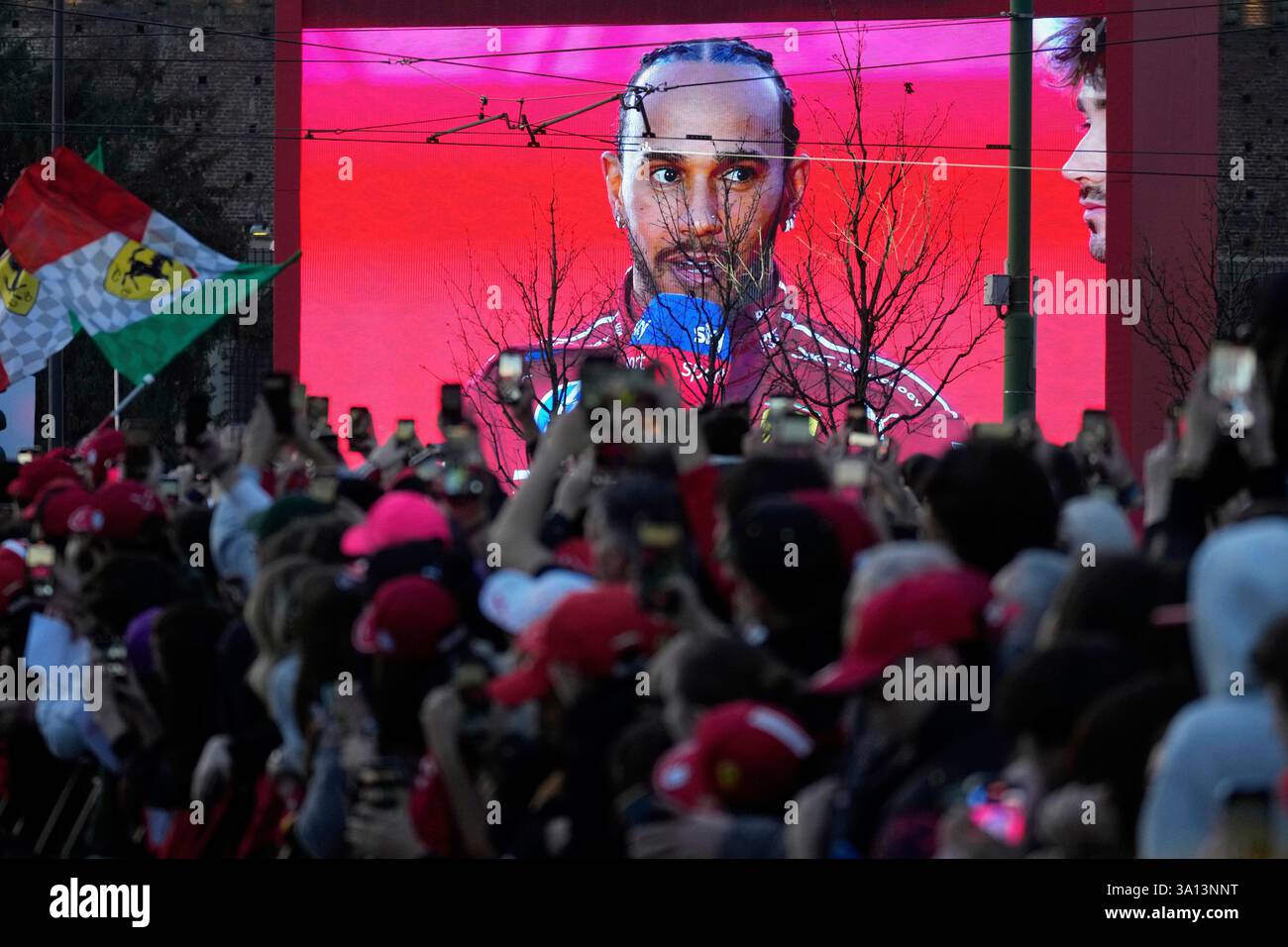 Ferrari driver Lewis Hamilton, of Britain, is seen on a giant screen ...