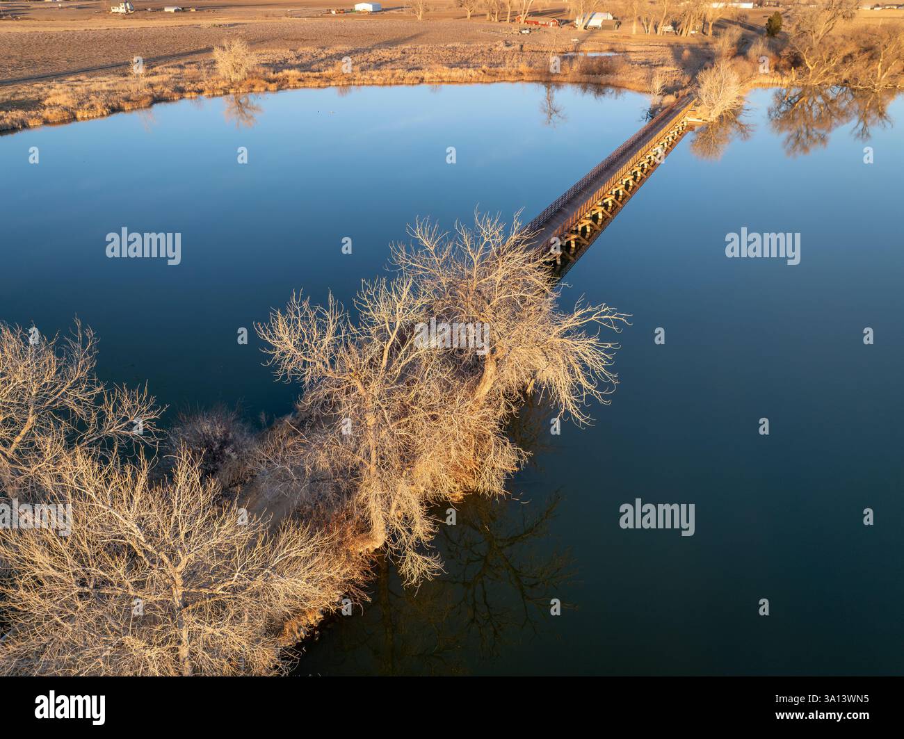 long trestle over Roulard Lake near Severance, Colorado in winter scenery - Great Western Bike ...