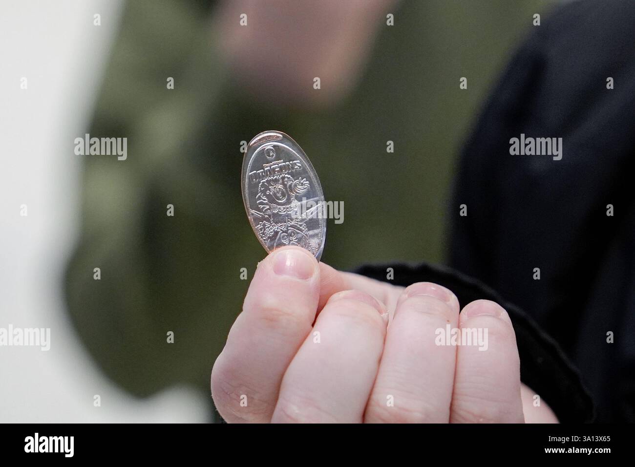 Hunter Kimbel, 7, holds a souvenir penny at the American Dream mall ...
