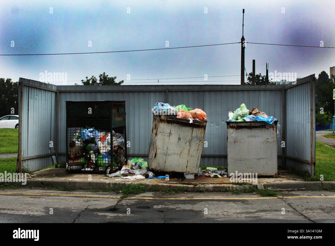 Metal garbage cans are filled to the brim with garbage. The problem of ...