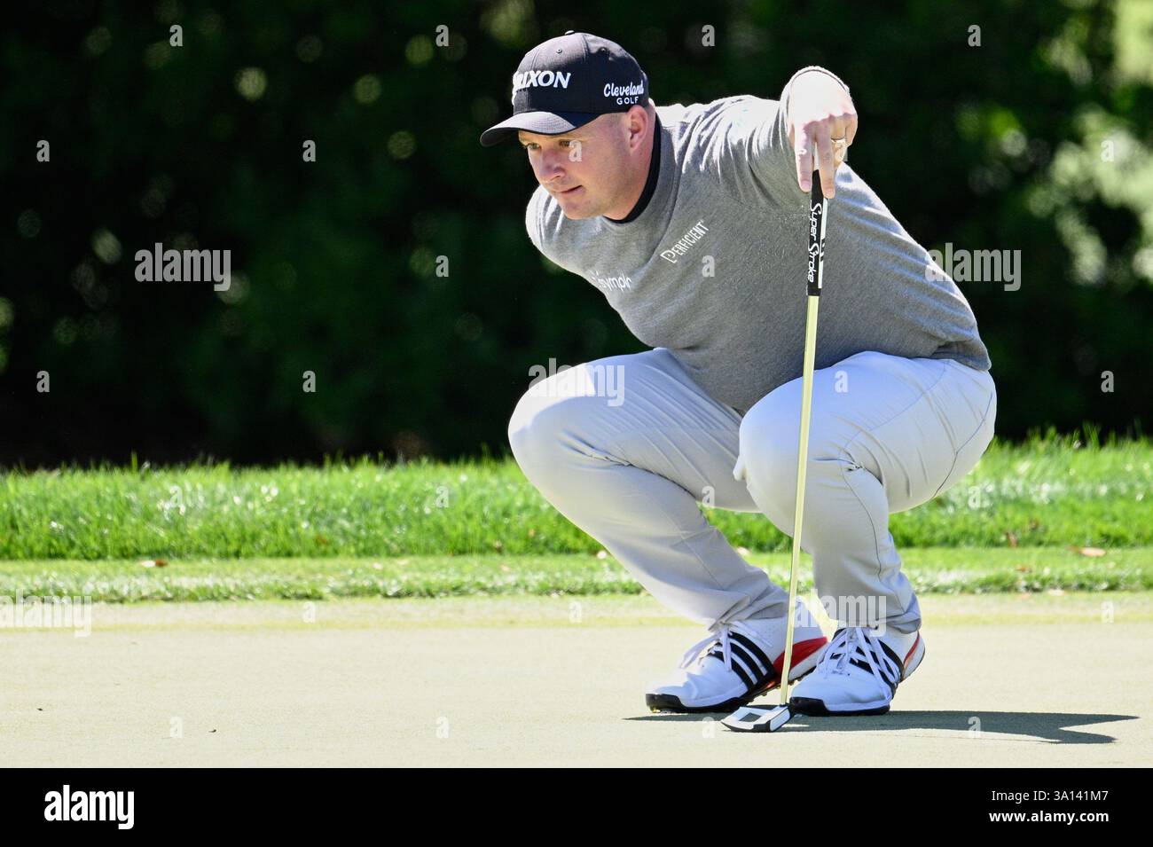 Sepp Straka, of Australia, lines up his putt on the first green during ...