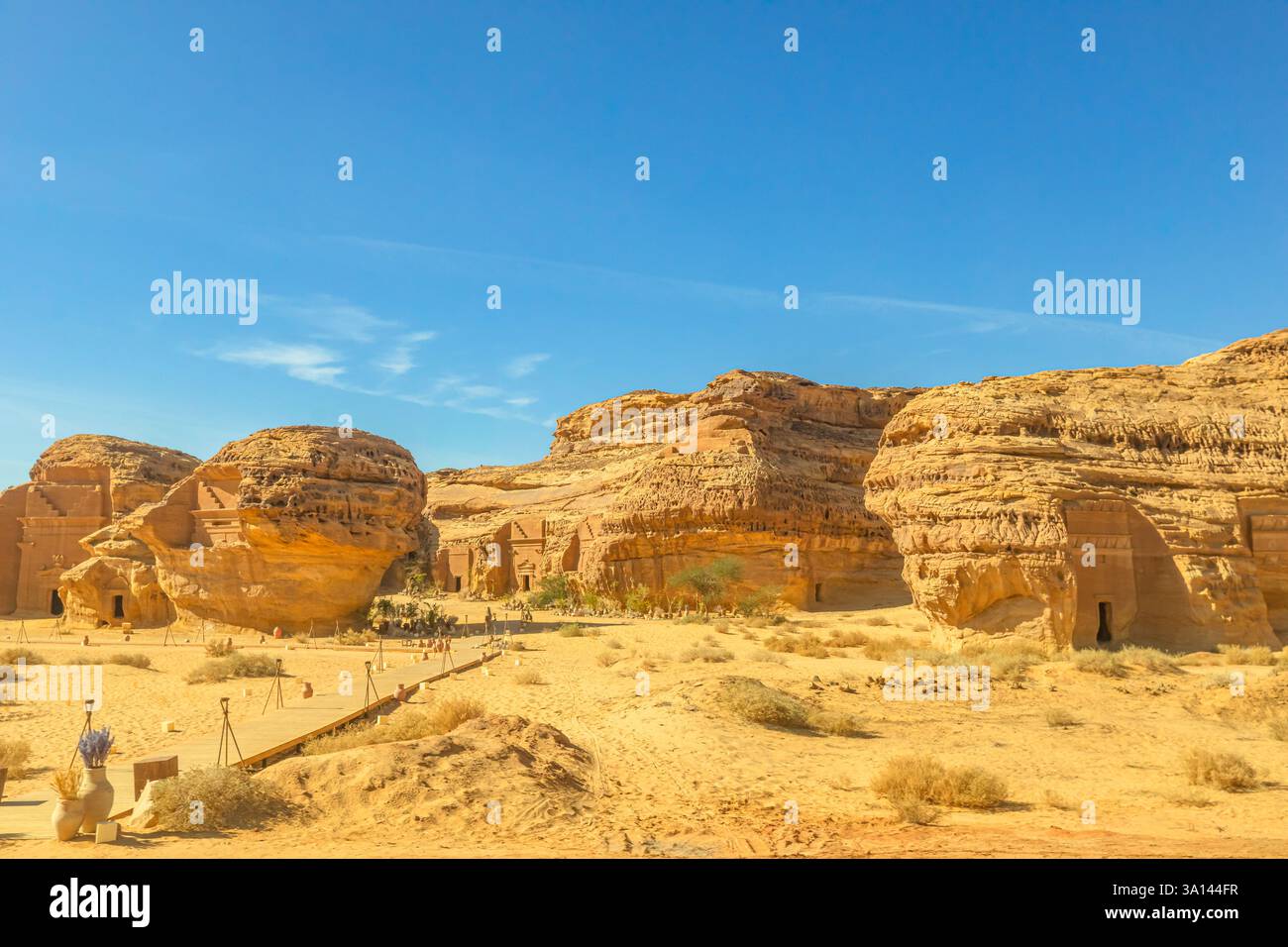 Al-Khuraymat Archaeological Site in sandstone mountains towering over ...