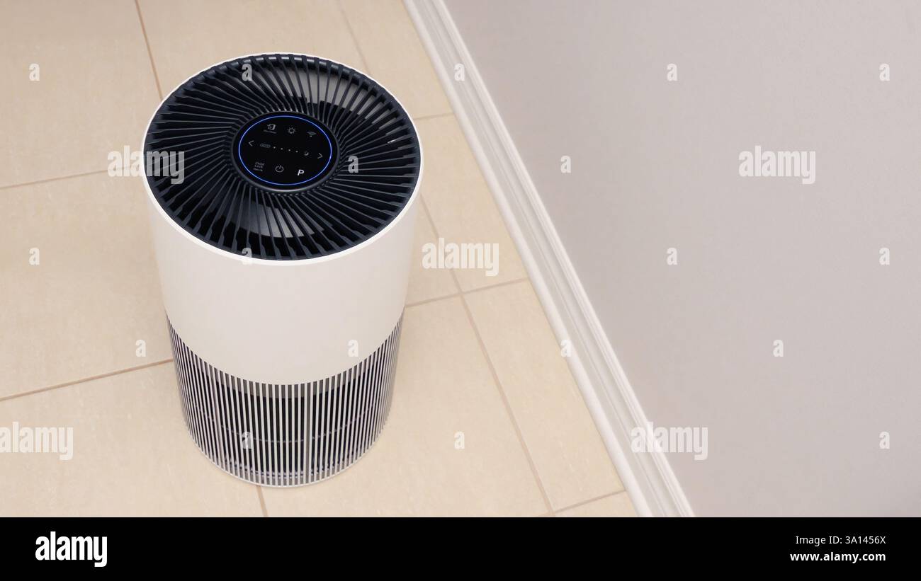 Sleek Modern Tall Air Purifier with Black Fan on Beige Tile Floor in ...