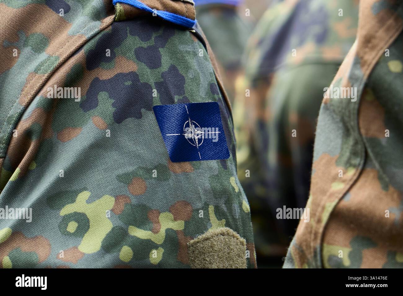 Bavaria, Germany - March 6, 2025: PHOTOMONTAGE, a soldier in camouflage ...
