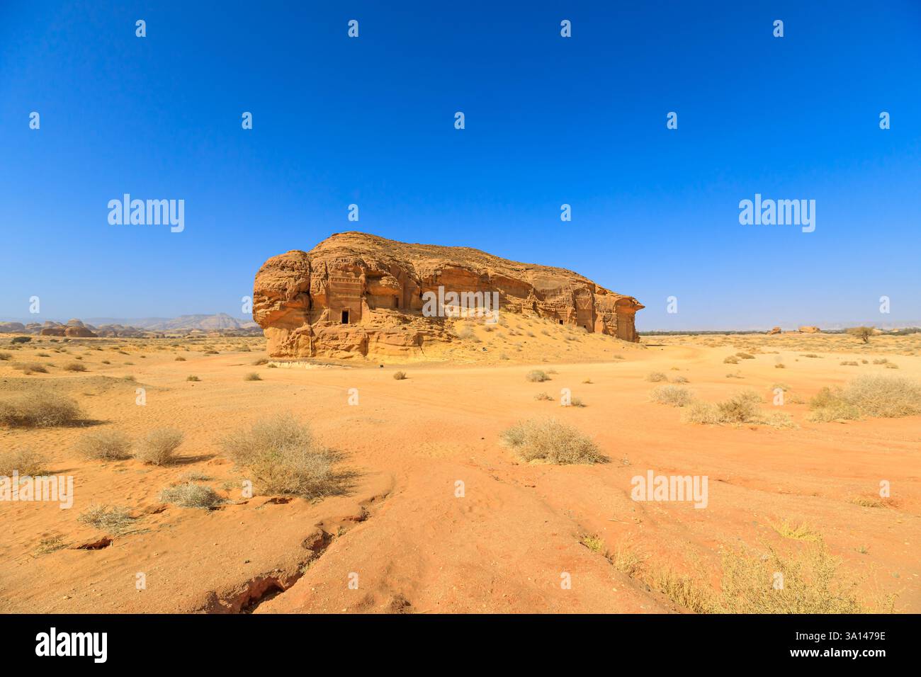 Sandstone tombs Jabal Al-Ahmar carved a rocks in Hegra, Madain Salih of ...