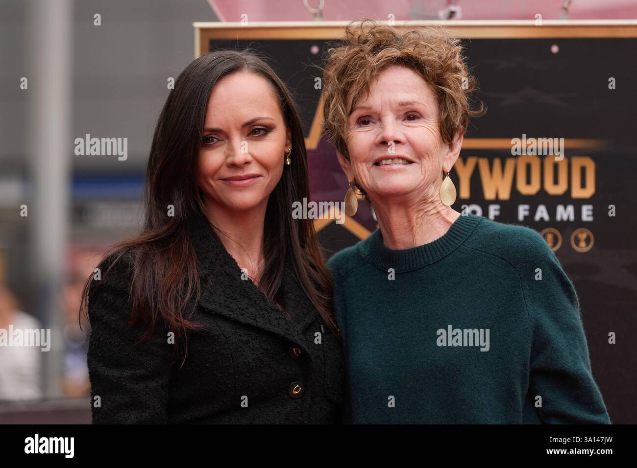Christina Ricci, left, and Sarah Ricci pose atop Christina Ricci's new ...