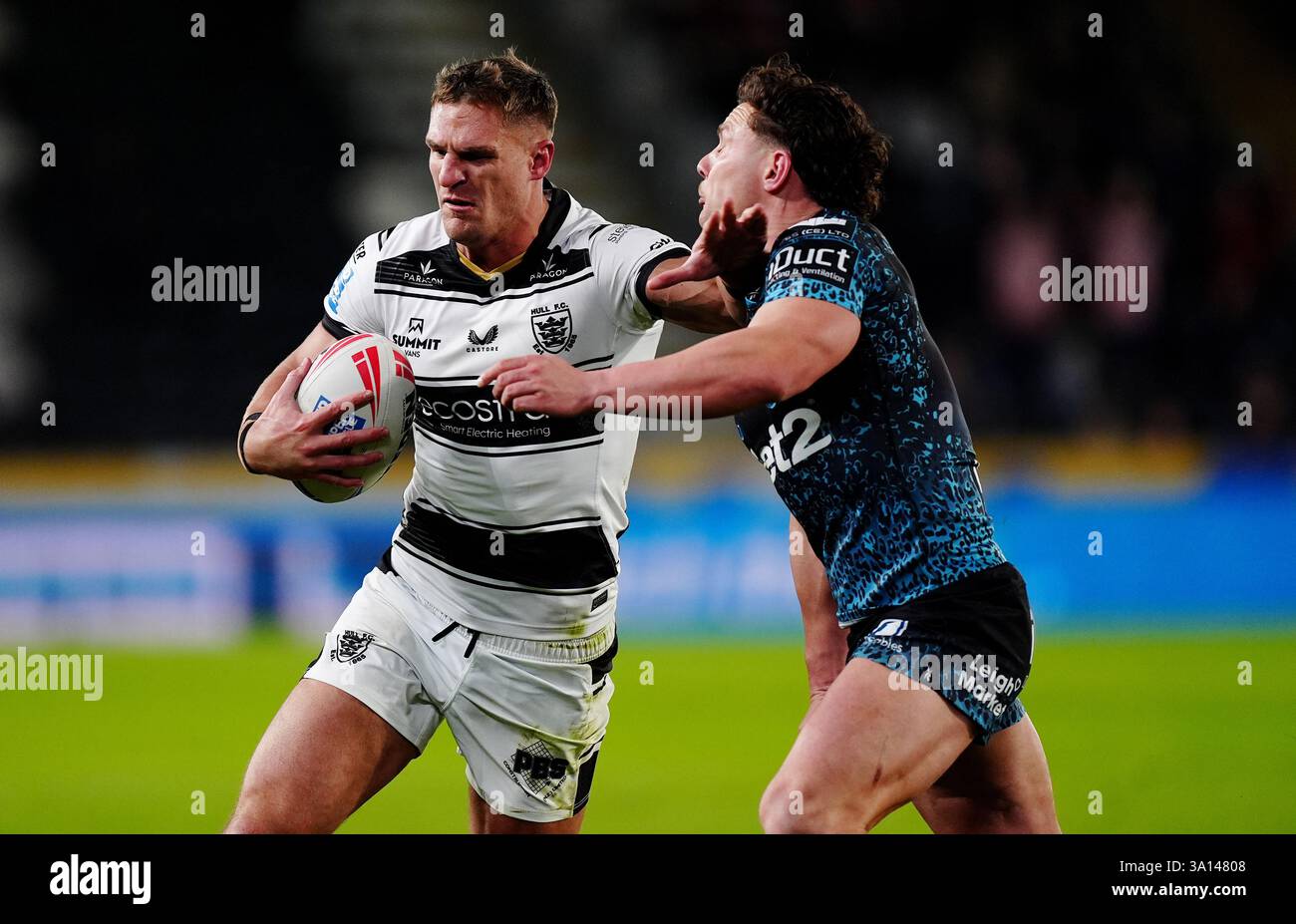 Hull FC's Jed Cartwright (left) is tackled by Leigh Leopards' Lachlan ...
