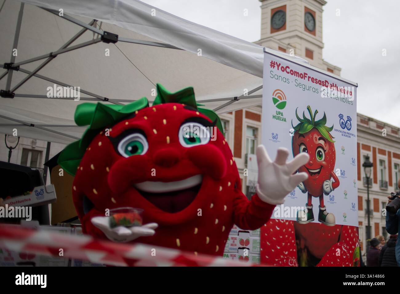 Madrid, Spain. 06th Mar, 2025. A figure dressed as a strawberry poses ...