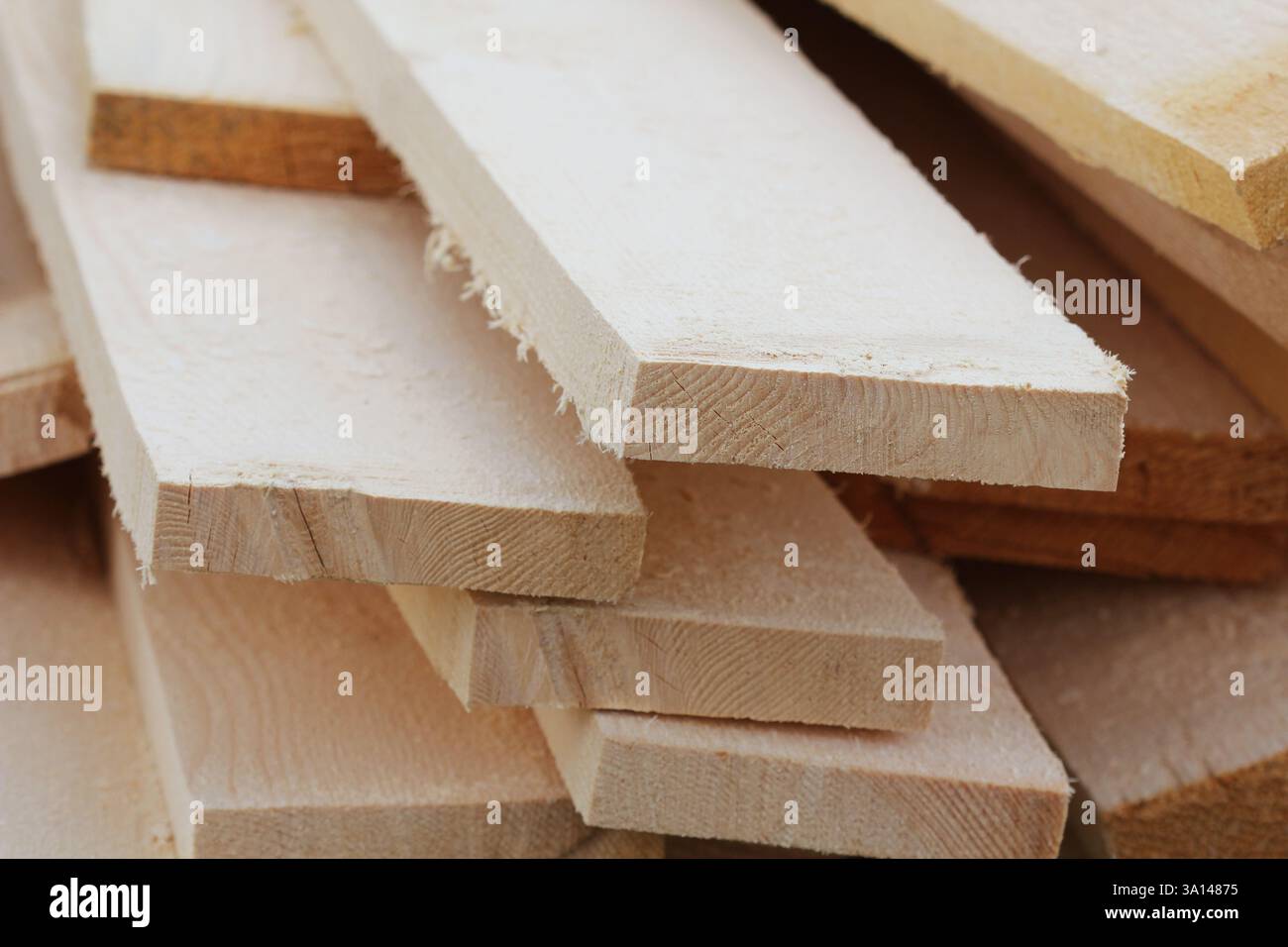 Stacks of pine wood planks. Natural rough wooden boards boards, lumber ...