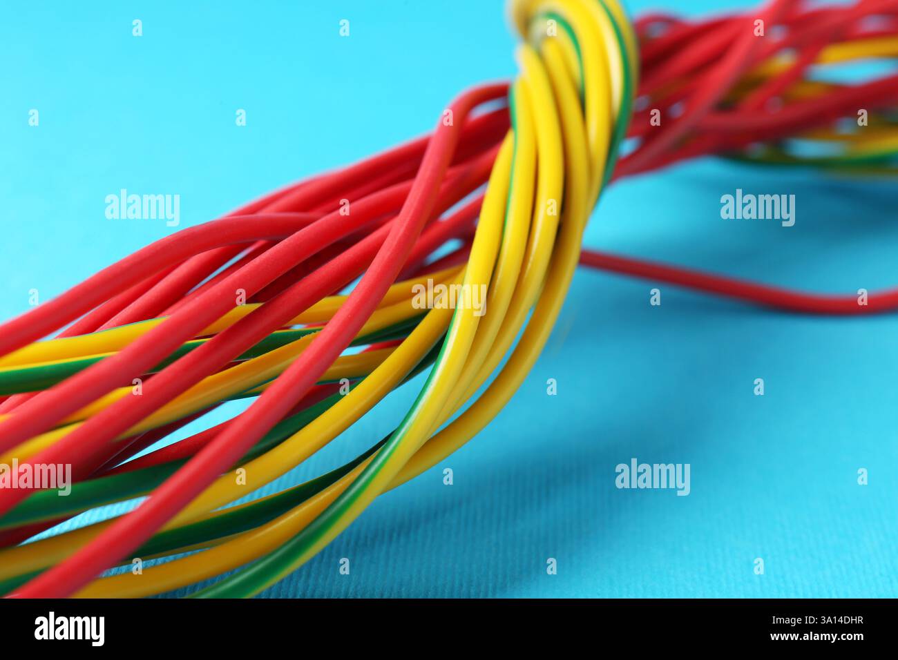 Many color electrical wires on light blue background, closeup Stock ...