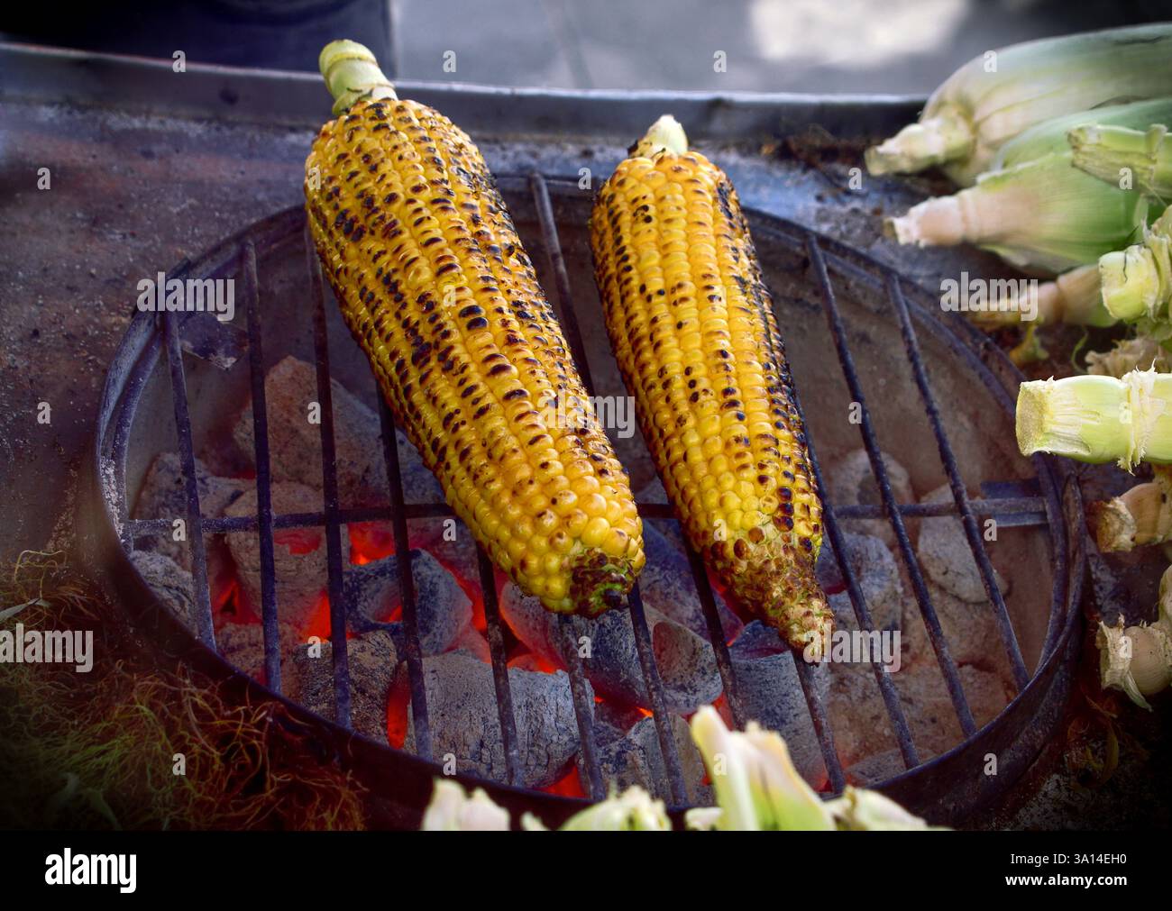 Corn roast on charcoal - street food Stock Photo - Alamy