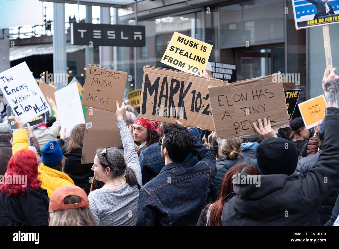Protestors outside a Tesla Dealer in New York City expressing their ...