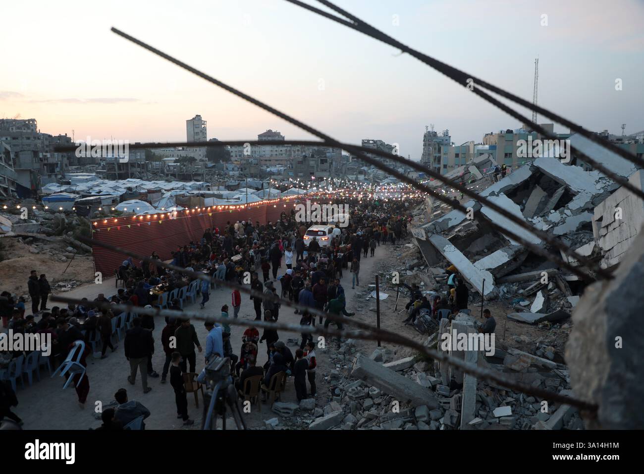 Gaza. 6th Mar, 2025. People gather for a group Ramadan iftar amid ...