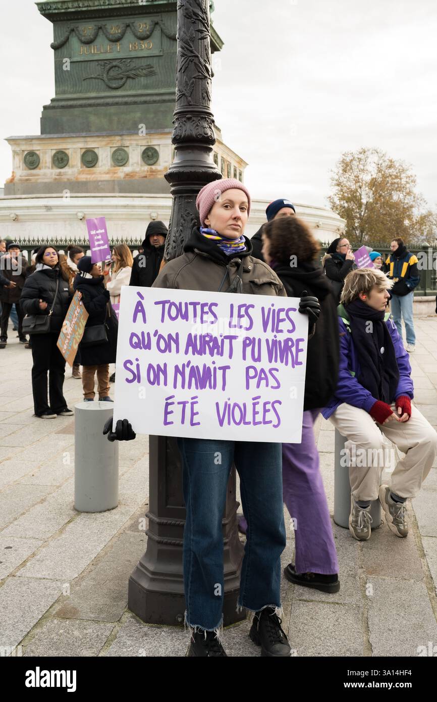 Women gather in solidarity to advocate against violence while holding ...