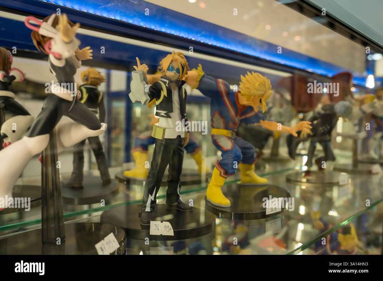 Collectible figures on display show vibrant characters in action at a ...