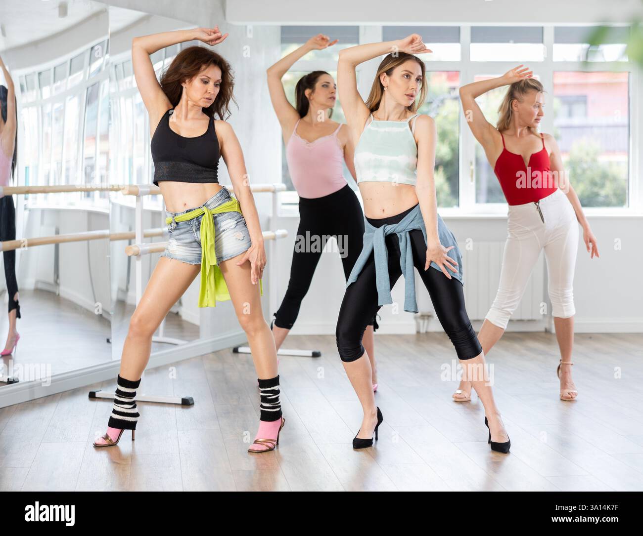 Group of women dancing high heels in studio Stock Photo - Alamy