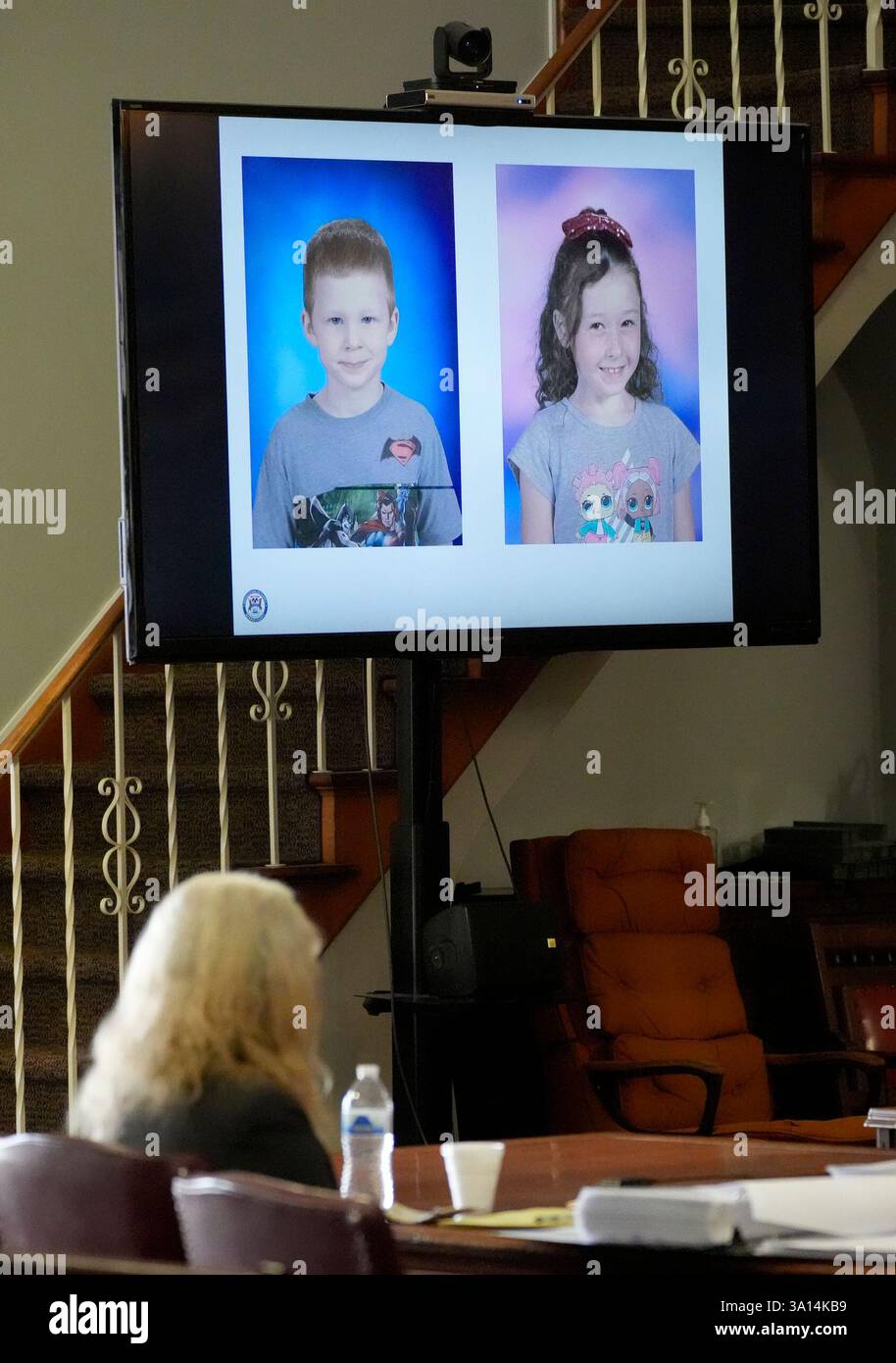 Marshella Chidester looks over at pictures of Alanah and Zayn Phillips ...