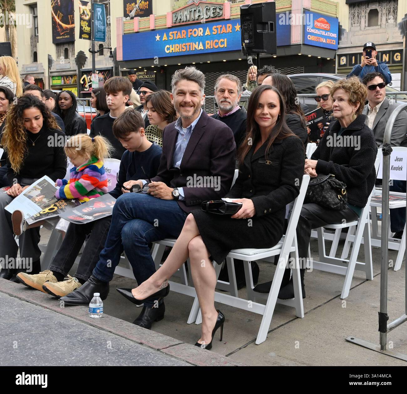 Actress Christina Ricci sits next her husband Mark Hampton during an ...