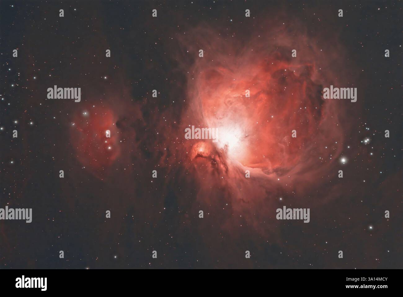 A breathtaking view of the Orion Nebula in stunning red hues, featuring ...