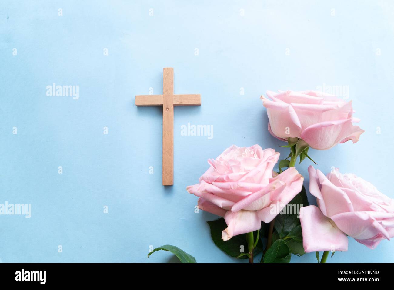 Simple design of an Easter cross with lilies Stock Photo - Alamy