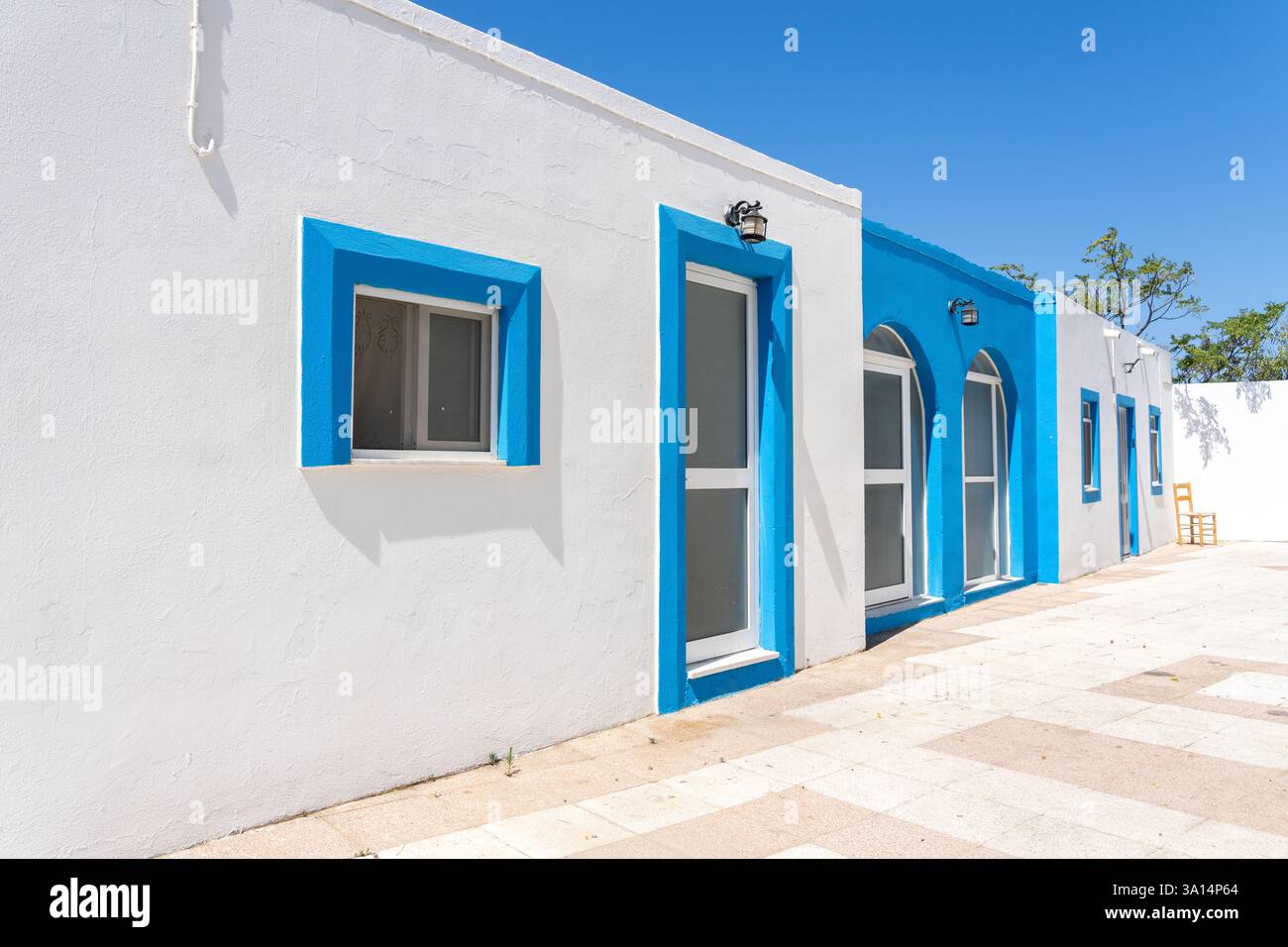 Iconic white and blue colours used on simple facade of building with ...