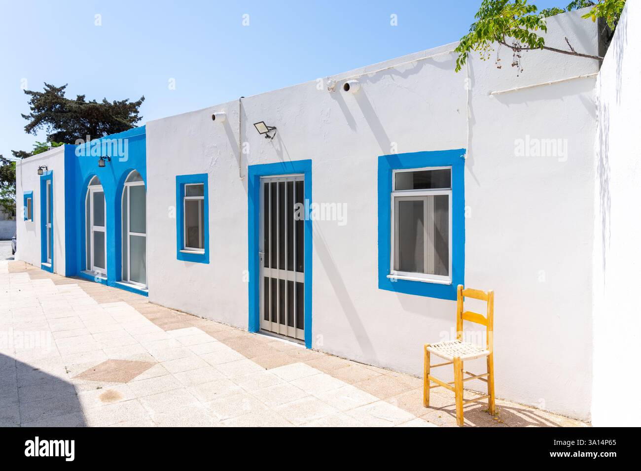 Iconic white and blue colours used on simple facade of building with ...
