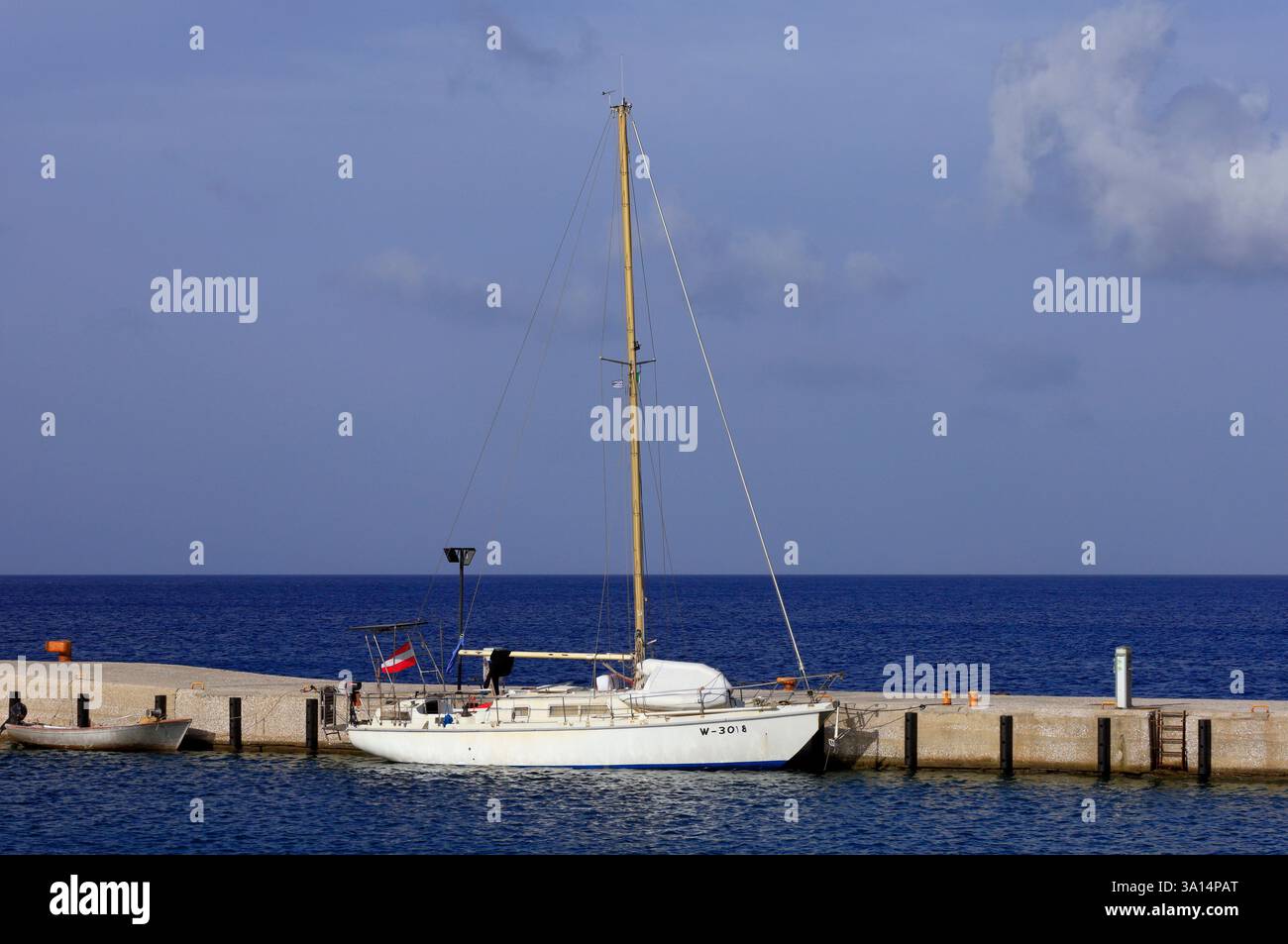 Yacht moored at Livadia harbour, Tilos Island, Dodecanese, Greece ...