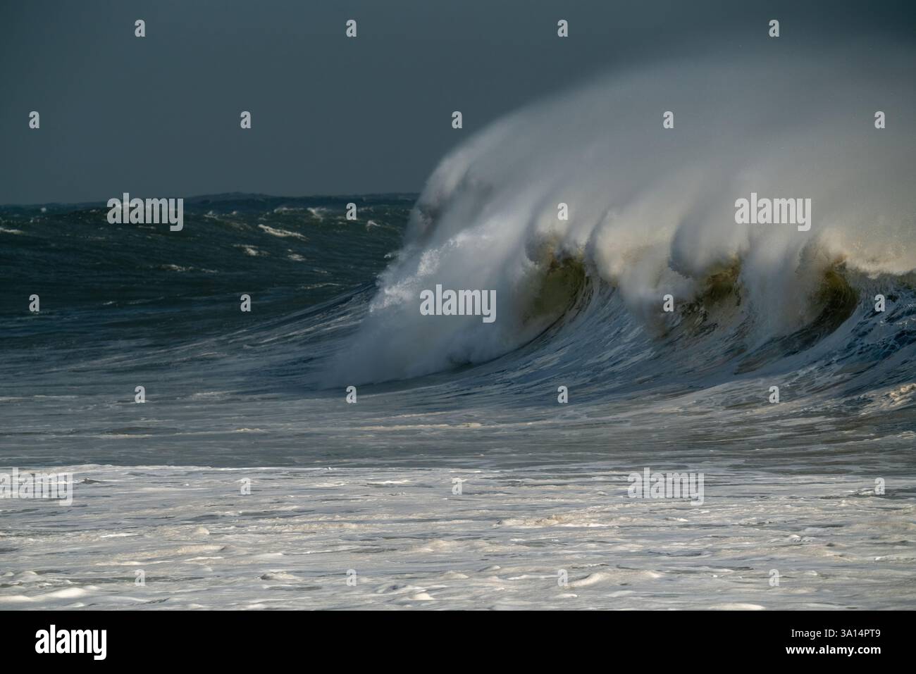 Spray is blown off the top of a wave as Cyclone Alfred approaches the ...
