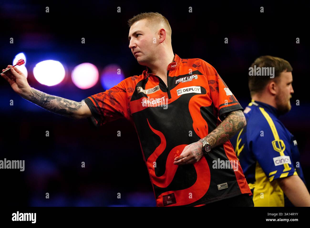 Nathan Aspinall in action against Luke Littler in the final during ...