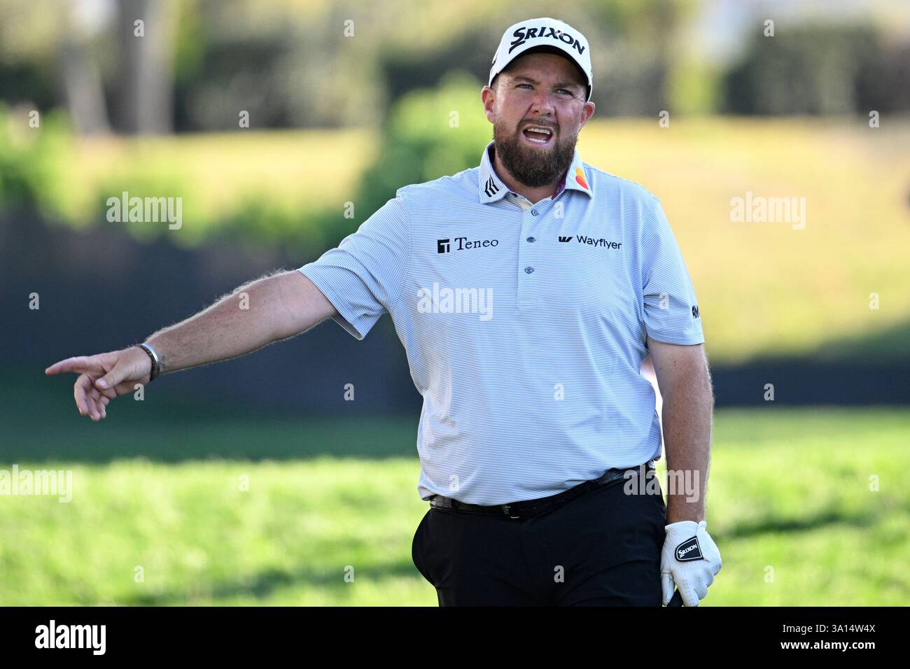 Shane Lowry, of Ireland, shouts after hitting his tee shot on the 18th ...