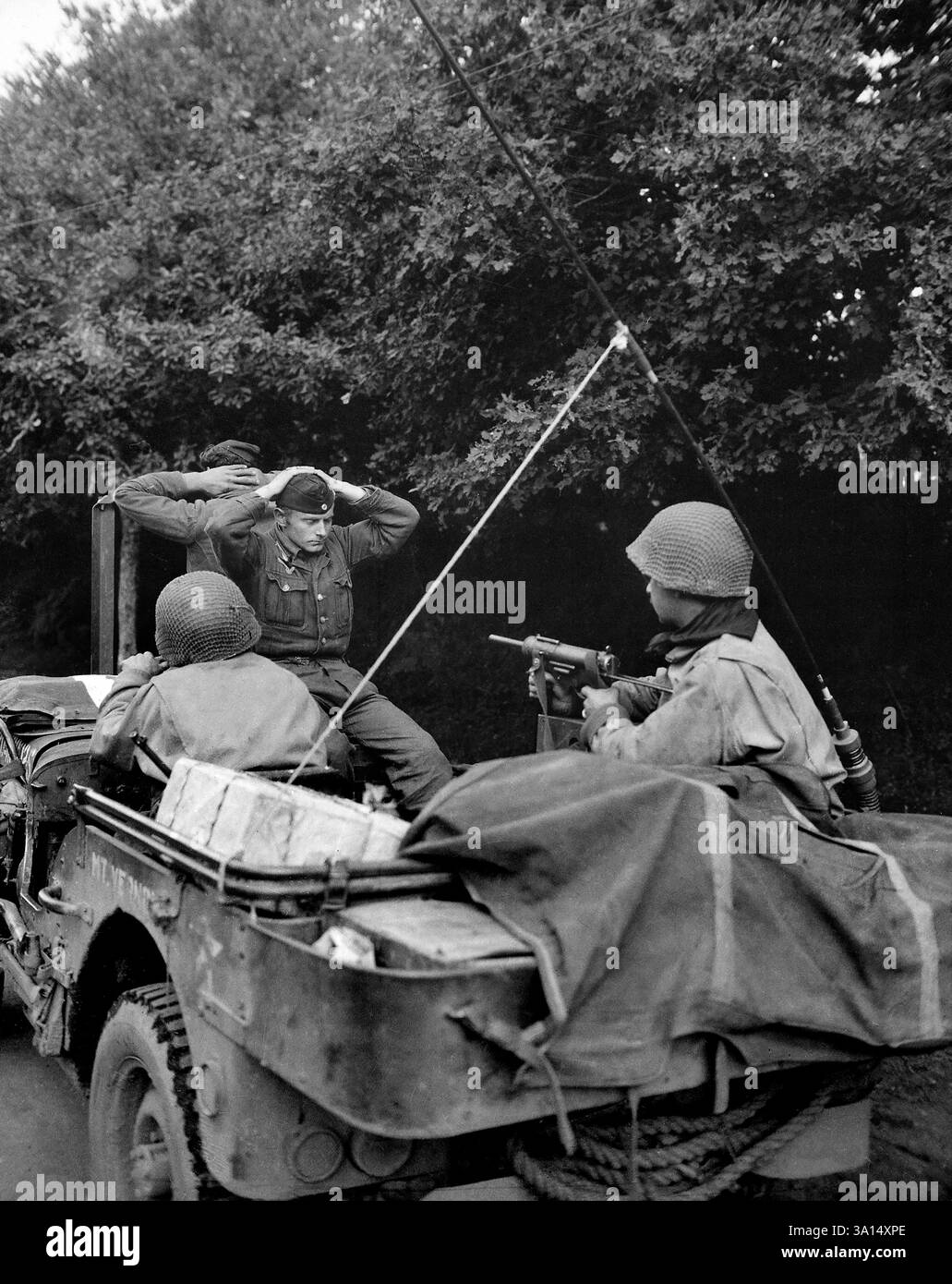 Two German prisoners of war being taken to U.S. 6th Division Prisoner ...