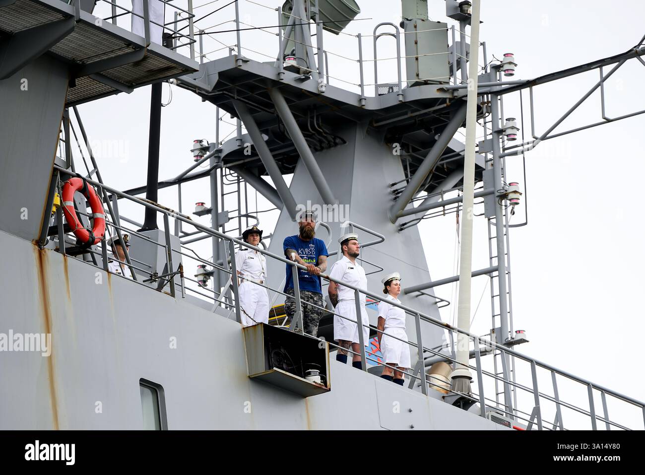 Lithuanian rower Aurimas Mockus (centre) is seen onboard the HMAS ...