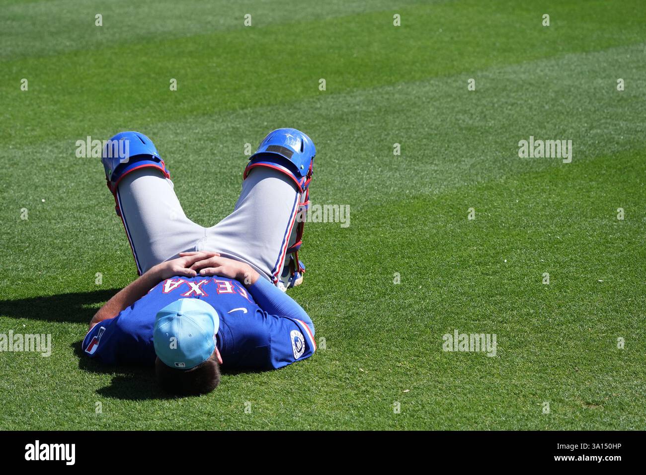 Texas Rangers' Malcolm Moore takes a break from stretching prior to a ...