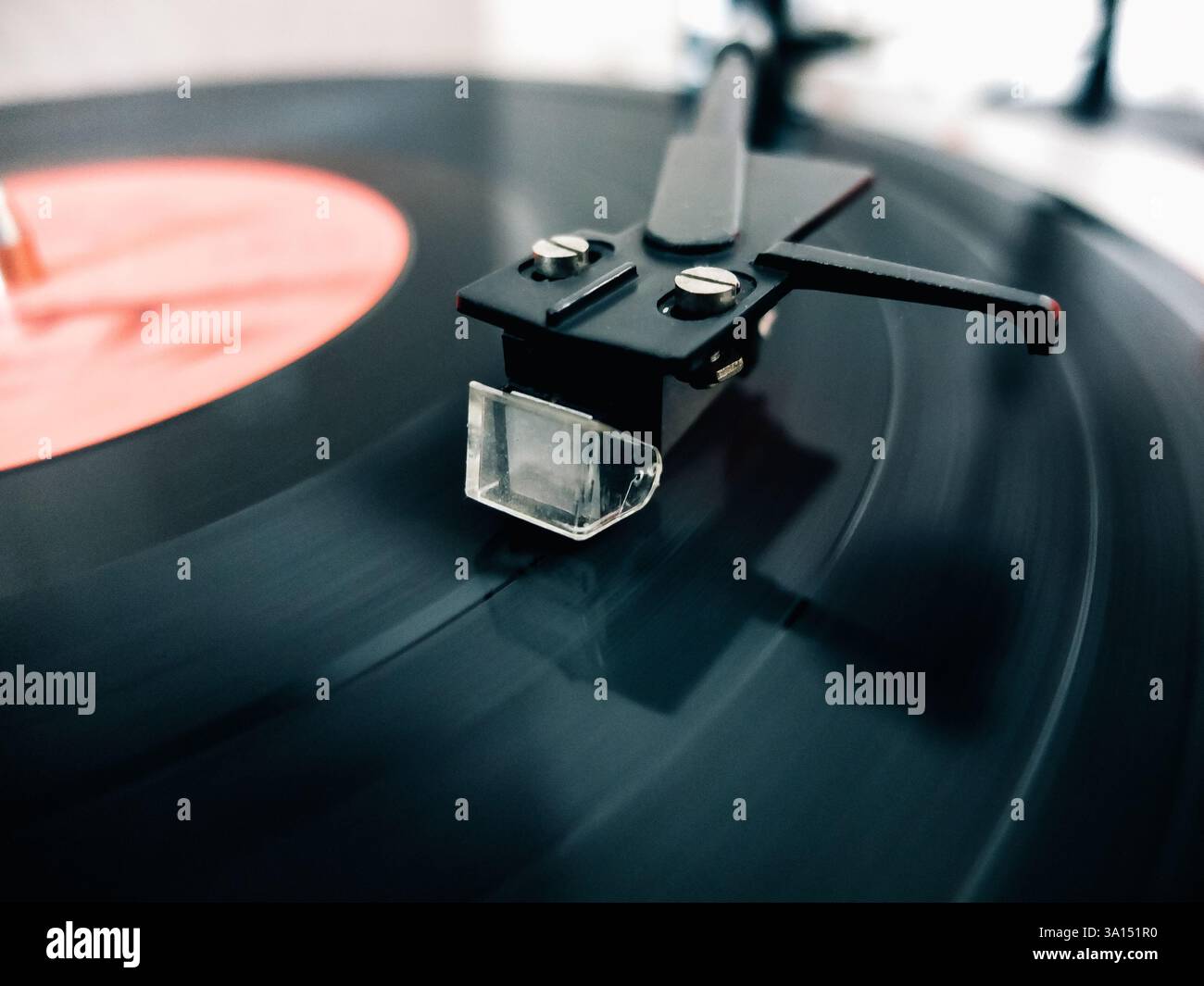 Close-up of a cartridge head on a vinyl record, analog retro music ...