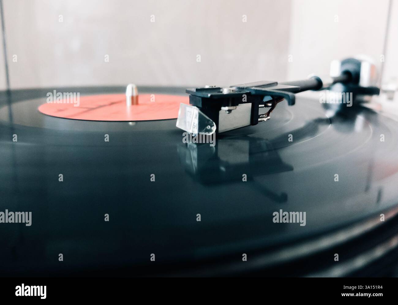 Close-up of a cartridge head on a vinyl record, analog retro music ...
