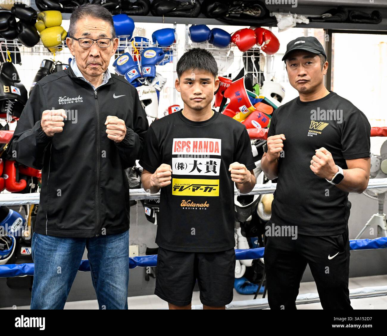Hiroto Kyoguchi (C) of Japanm his trainer Takamutsu Kobayashi (R) and Watanabe boxing gym ...
