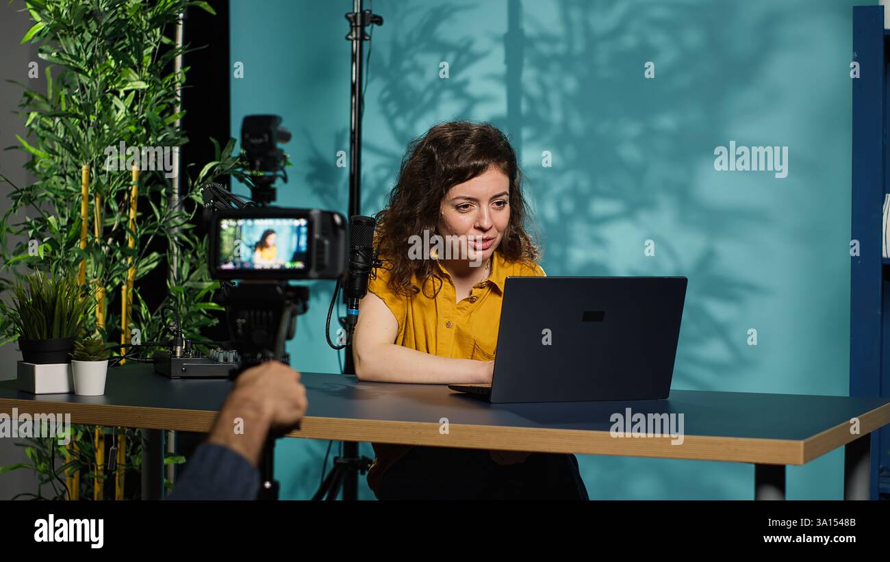 Content creator using production camera gear to film motivational type ...