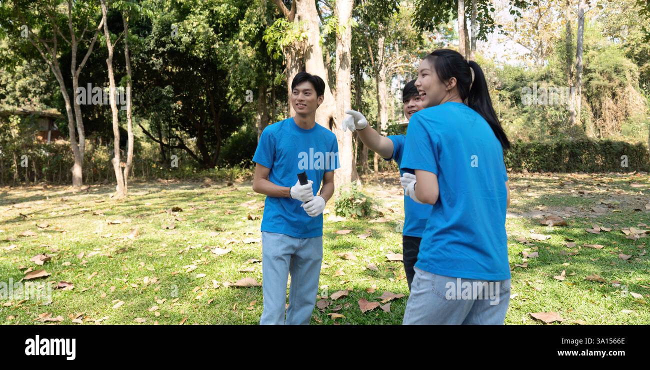 Sustainable volunteering. Volunteers celebrating teamwork during an eco ...