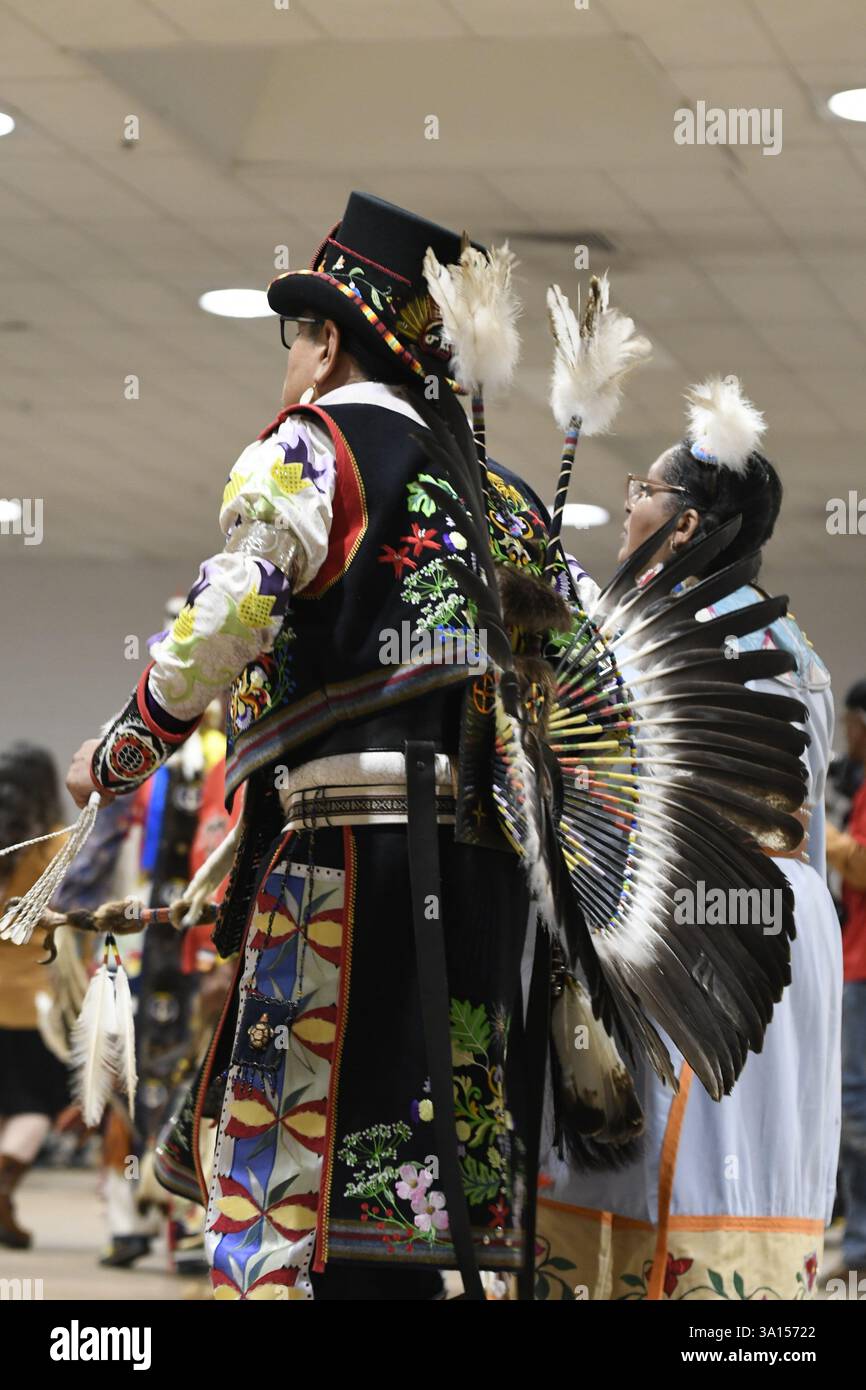 Native American male dressed in traditional custom wearing a derby hat ...