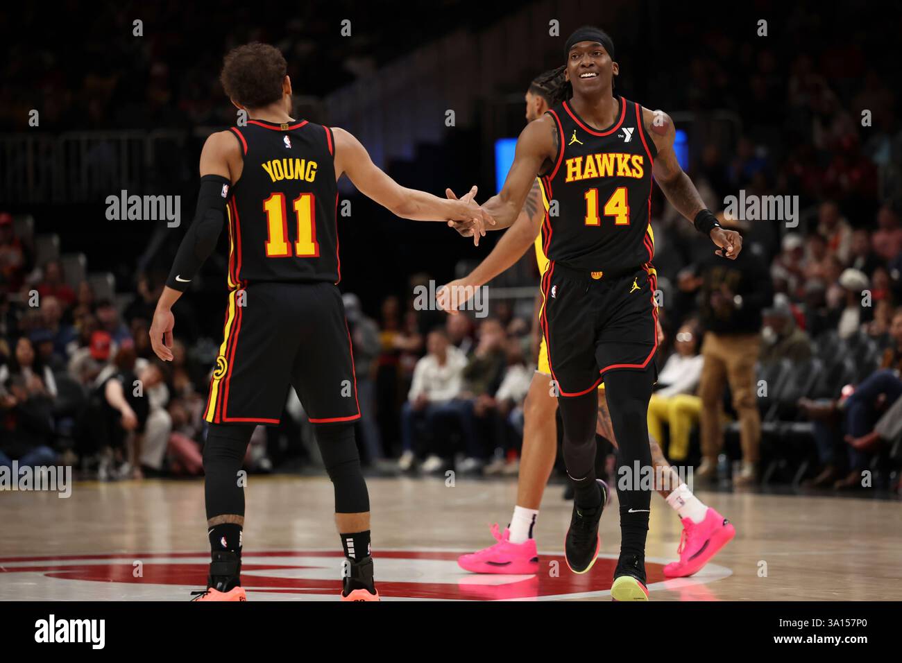 Atlanta Hawks guard Trae Young (11) celebrates with teammate terance ...