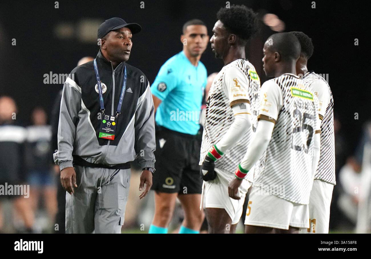 Cavalier head coach Rudolph Speid, left, talks with his players during ...