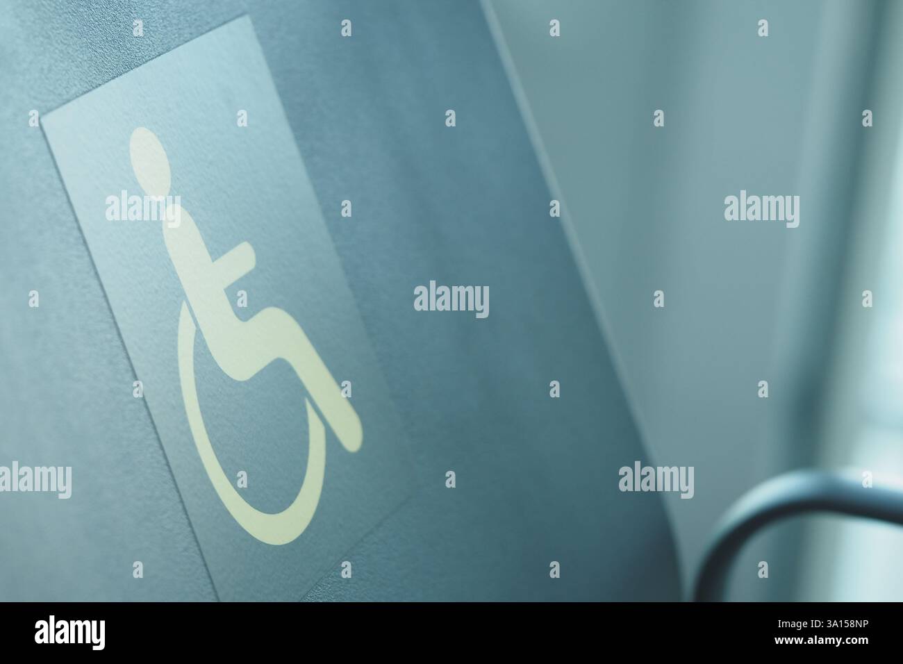 A sign indicating accessible seating for passengers with disabilities ...