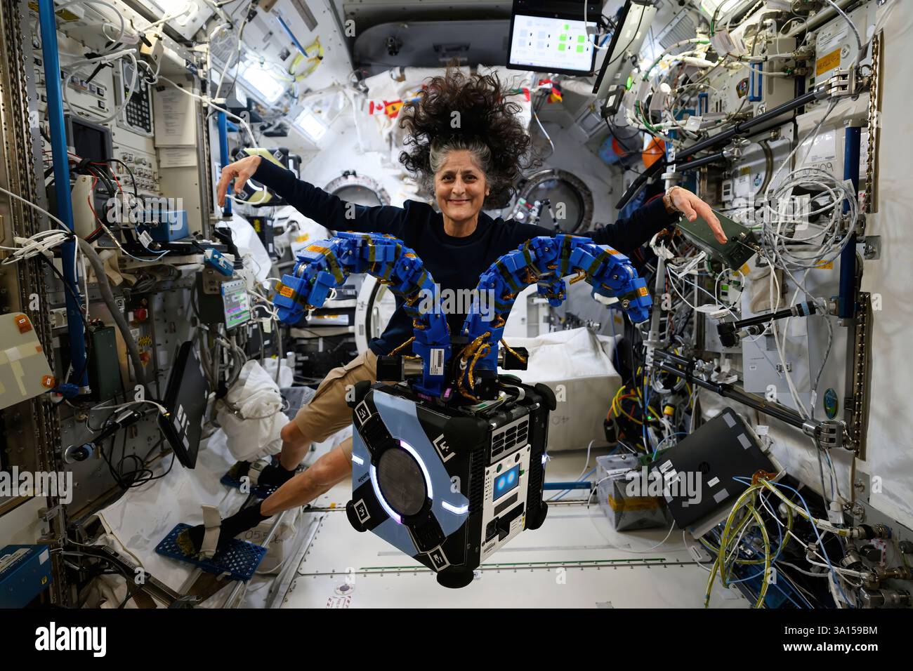 NASA astronaut Suni Williams interacts with the Astrobee robotic free ...