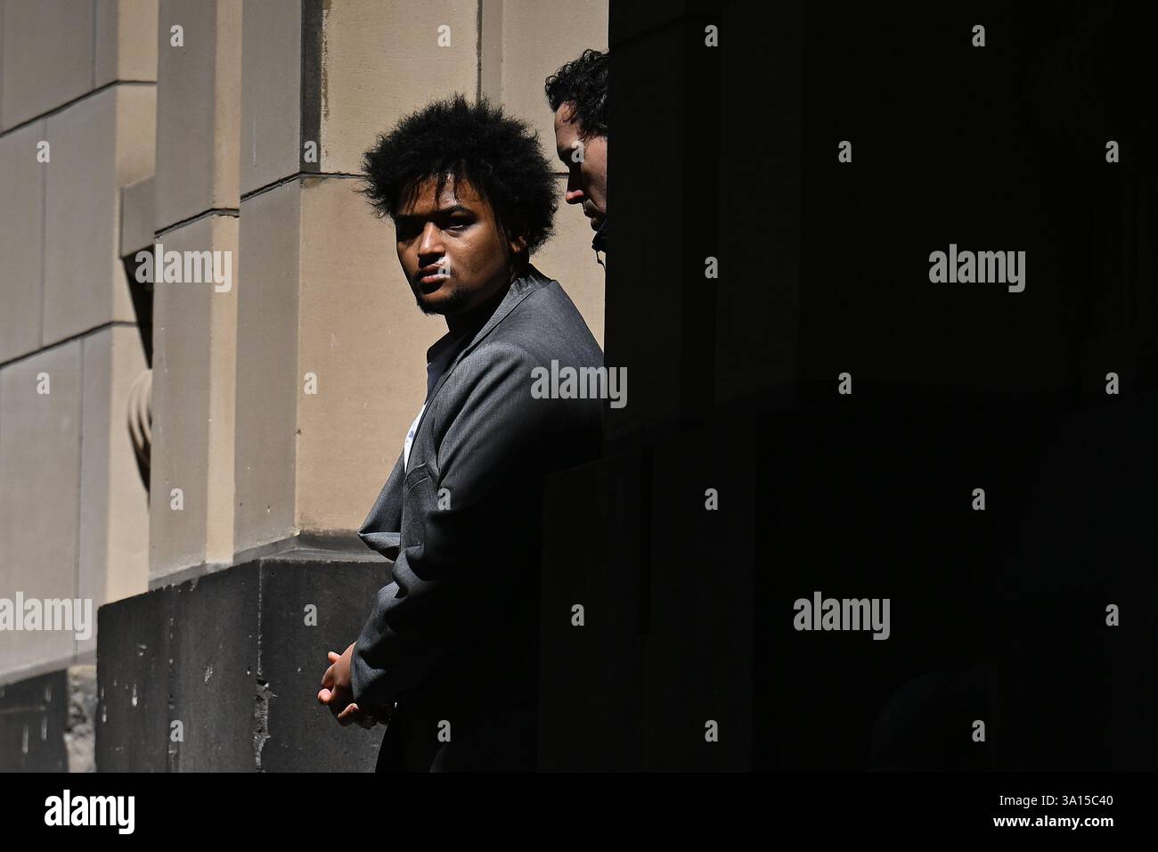Aron Gebregiorgis (left) departs from the Supreme Court of Victoria in ...