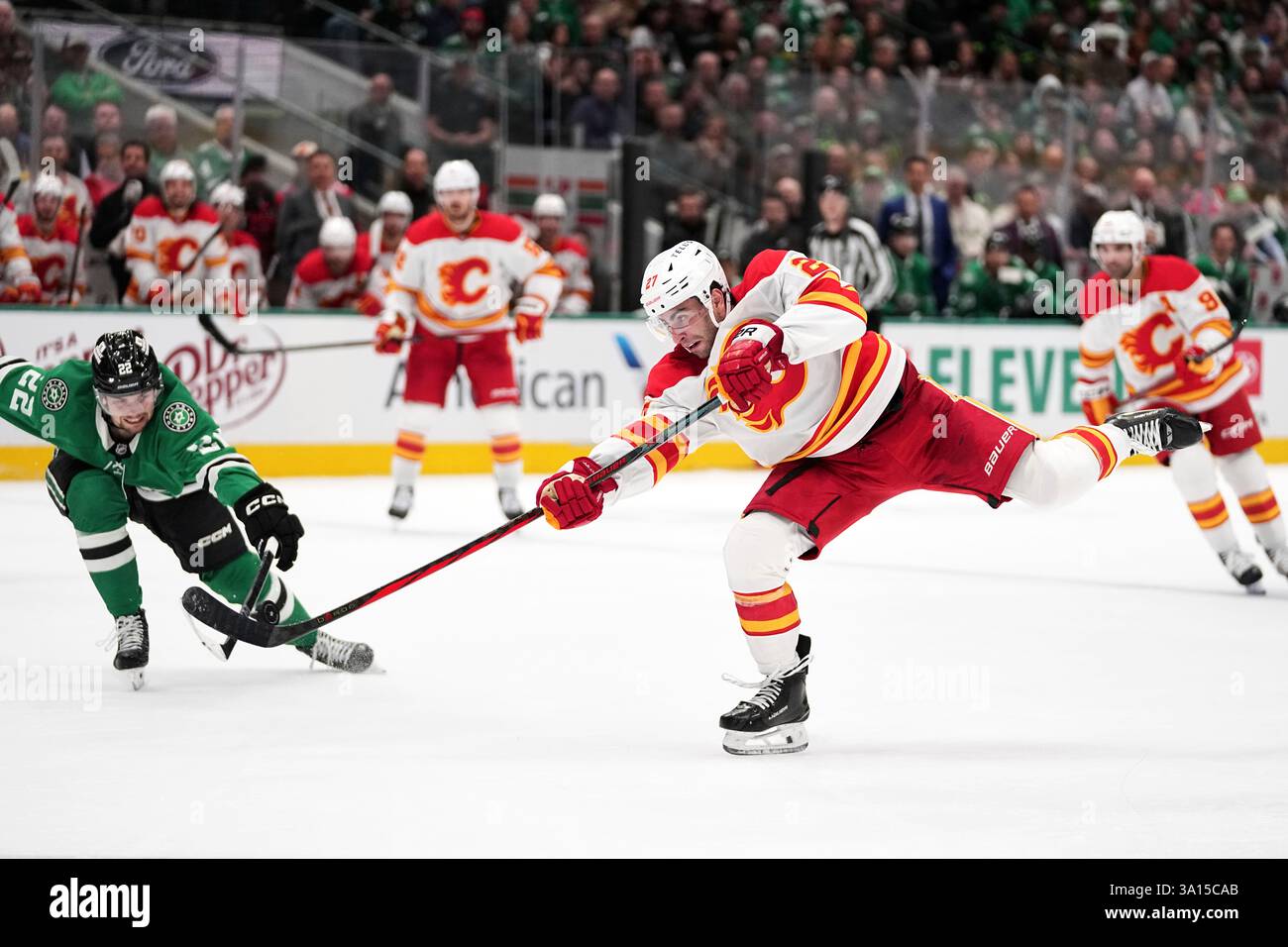 Calgary Flames right wing Matt Coronato (27) has his shot deflected by ...