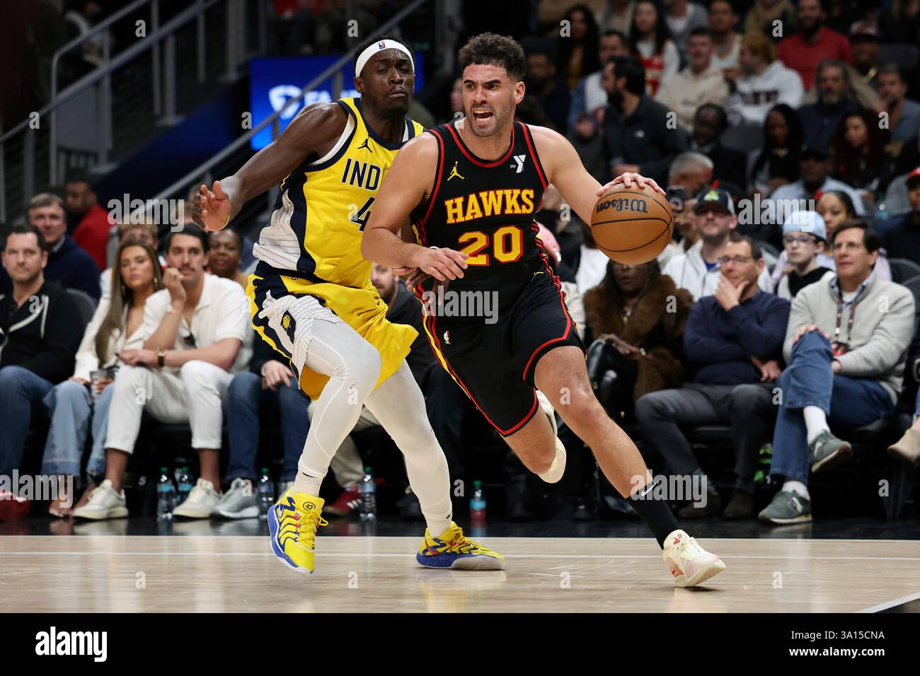 Atlanta Hawks forward Georges Niang (20) drives to the basket against Indiana Pacers forward ...