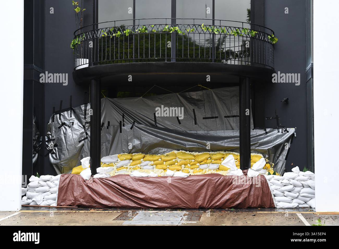 Sandbagging is seen at a business in Milton, in Brisbane, Queensland ...