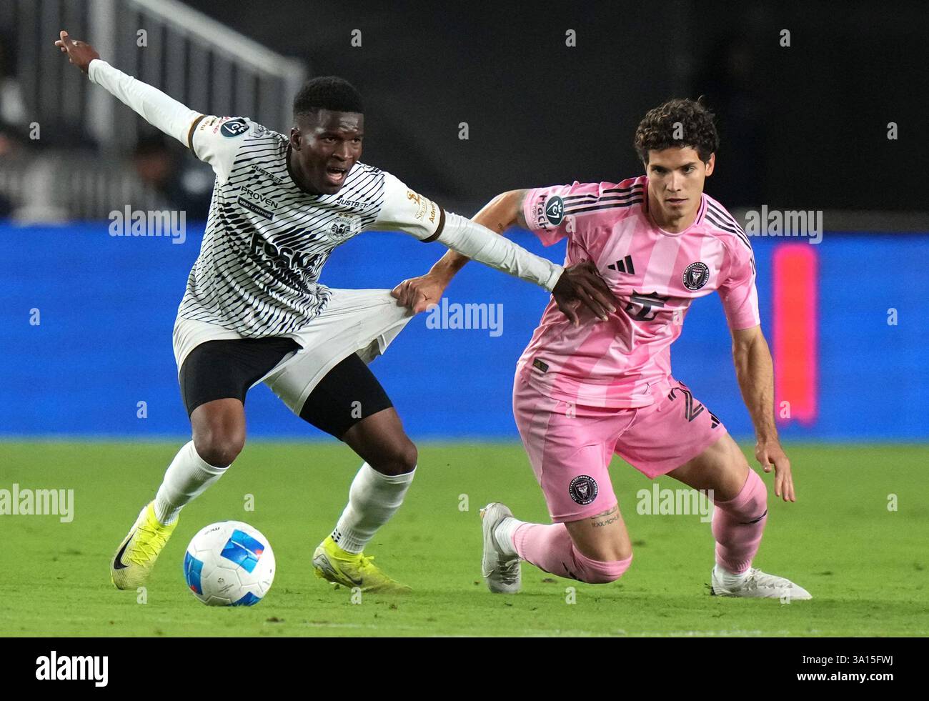 Cavalier midfielder Christopher Ainsworth, left, goes for the ball as ...