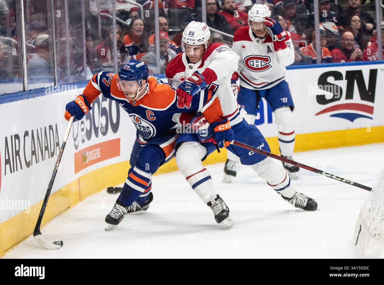 Montreal Canadiens' Christian Dvorak (28) and Edmonton Oilers' Connor ...
